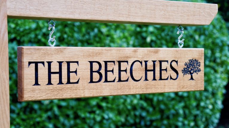 Engraved Oak Hanging Sign on Post | MakeMeSomethingSpecial.com